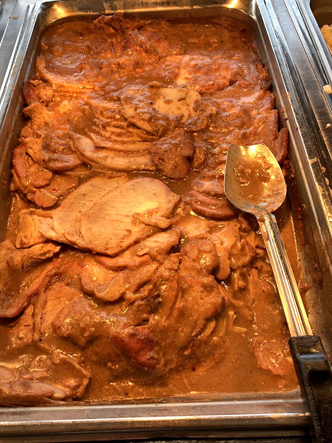 Roast pork swimming in gravy that looks like liquid comfort, the kind your grandmother would approve of.