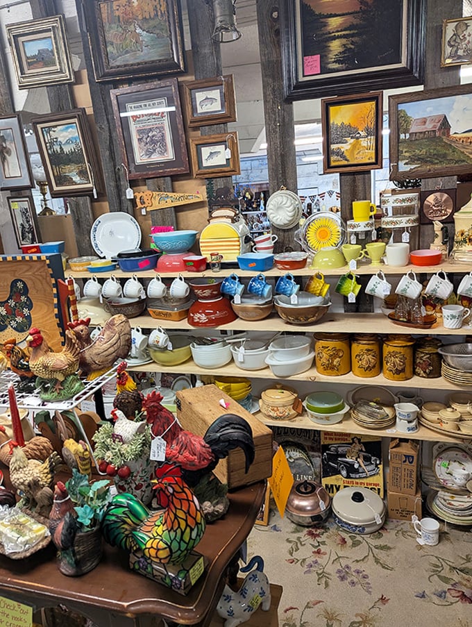 Ceramic roosters stand guard over vintage Pyrex and Depression glass. The chicken-to-kitchenware ratio here suggests someone had very specific collecting priorities.