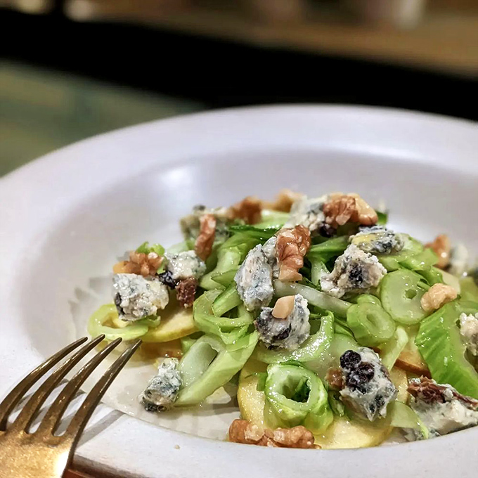 A salad that could convert even the most dedicated carnivore—crisp, vibrant, and adorned with blue cheese and walnuts like nature's perfect accessory.