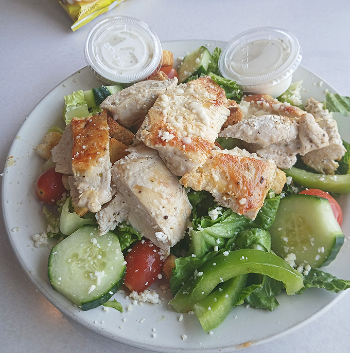 A salad that doesn't apologize for being healthy. Grilled chicken, fresh vegetables, and feta create the rare diner dish you can brag about to your doctor.