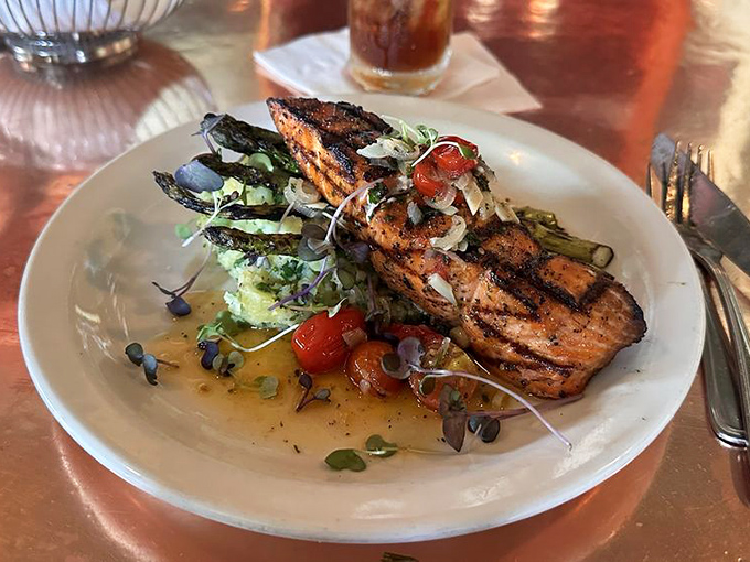 Salmon that's mastered the art of the perfect sear &ndash; crispy outside, tender inside, like nature's best magic trick.