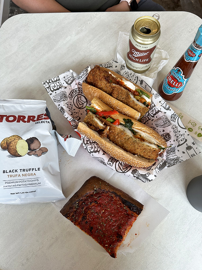 A perfect lunch trifecta: crispy sandwich, artisanal chips, and tomato pie &ndash; Pennsylvania's answer to flat pizza.