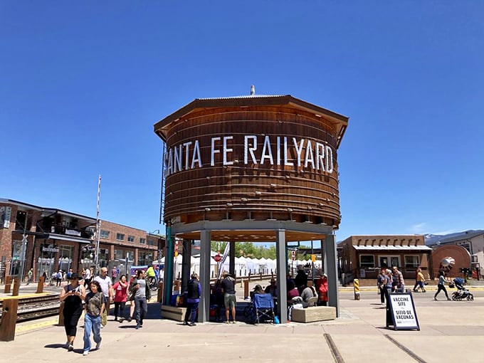 The iconic Santa Fe Railyard water tower stands sentinel over the market grounds, a reminder of the area's transformation from industrial hub to cultural hotspot.