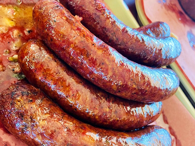 Sausages with that perfect snap &ndash; like biting into summer itself. The kind that make you understand why Texans debate barbecue with religious fervor.