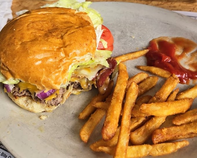 A burger that requires both hands and a strategy &ndash; layered with cheese, veggies, and pure Pennsylvania satisfaction.