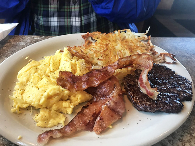The holy trinity of breakfast perfection: fluffy scrambled eggs, crispy hash browns, and bacon that strikes that magical balance between chewy and crisp. Hallelujah!