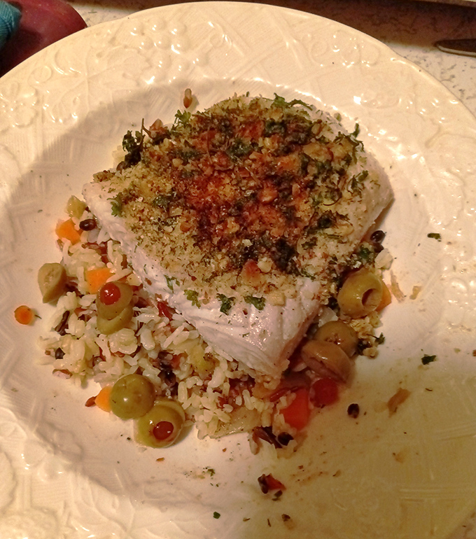 Herb-crusted fish that looks like it jumped straight from ocean to plate, with a detour through flavor town.