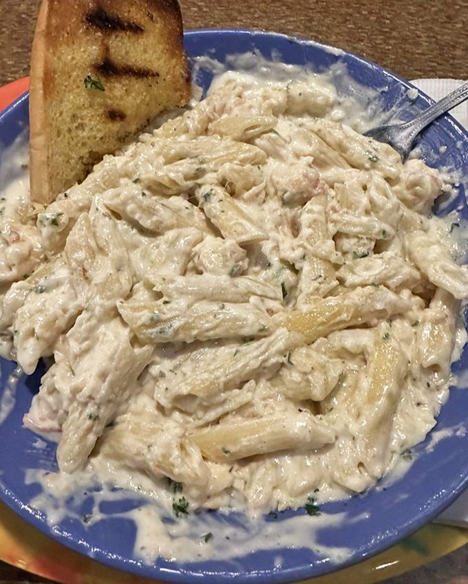 Seafood Alfredo that proves pasta and ocean creatures were meant to be together, like Sonny and Cher but tastier.