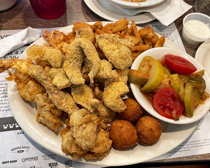 A seafood platter that doesn't know the meaning of restraint&mdash;fried catfish, shrimp, and hush puppies staging a delicious rebellion against diet plans.