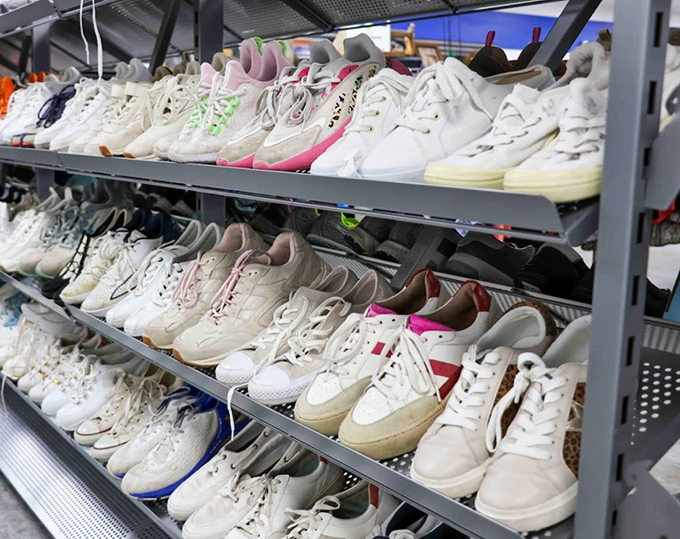 White sneakers as far as the eye can see&mdash;like a cloud formation of footwear possibilities. Clean, organized, and ready for new adventures.