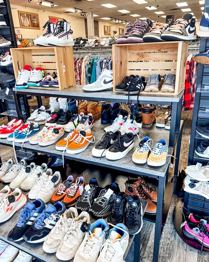 Sneaker heaven! From pristine Nikes to checkered Vans, this footwear display proves secondhand doesn't mean second-rate in the shoe department.