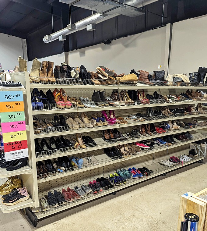 Cinderella had one glass slipper, but you've got an entire wall of footwear possibilities organized by color-coded discount tags. Fairy godmother approved!