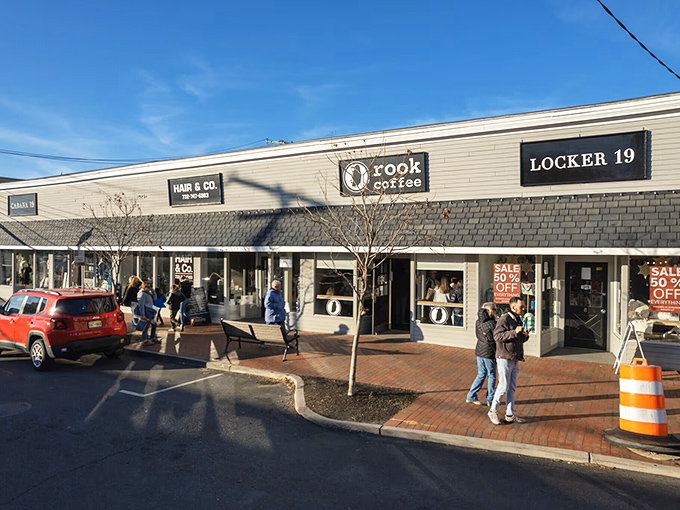 Rook Coffee draws locals and visitors alike to this charming strip, where brick walkways and casual bench seating create neighborhood gathering spots.
