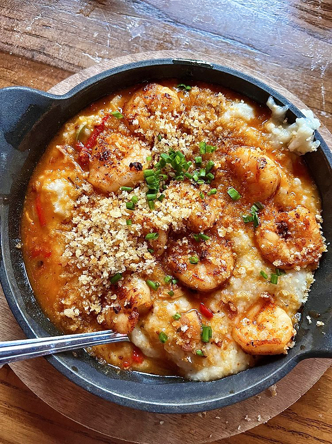 Shrimp and grits that would make Charleston jealous&mdash;creamy, cheesy cornmeal topped with plump shrimp and a sprinkle of wisdom.
