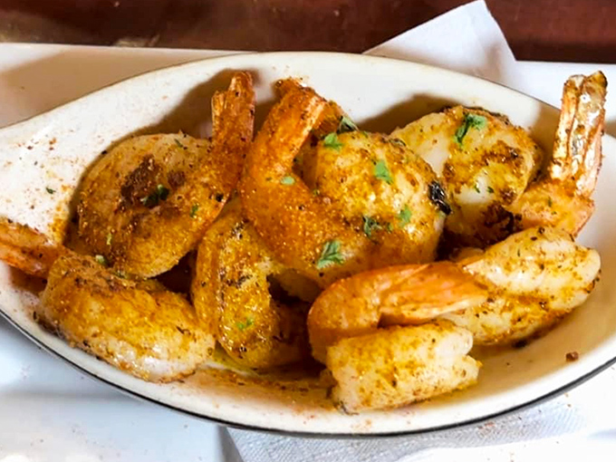 Golden shrimp that could make a seafood skeptic reconsider their life choices - crispy, seasoned, and absolutely irresistible.