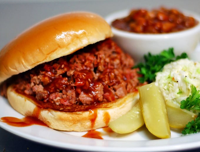 A proper barbecue sandwich should require both napkins and commitment. This one demands a stack of the former and absolute dedication of the latter.