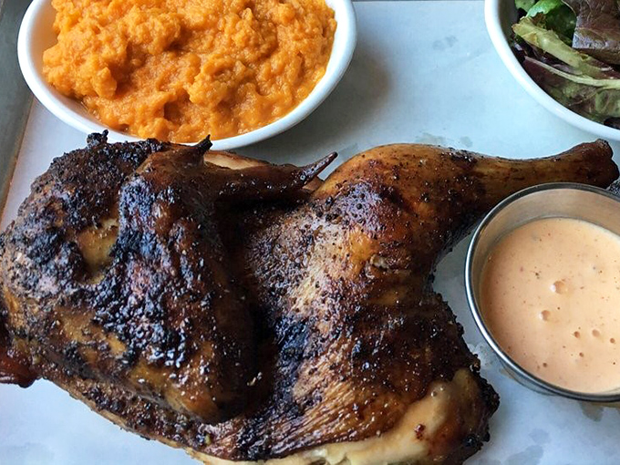 Smoky, juicy chicken that would make Colonel Sanders weep with envy. That vibrant orange side? Sweet potato heaven that'll make you rethink vegetables.