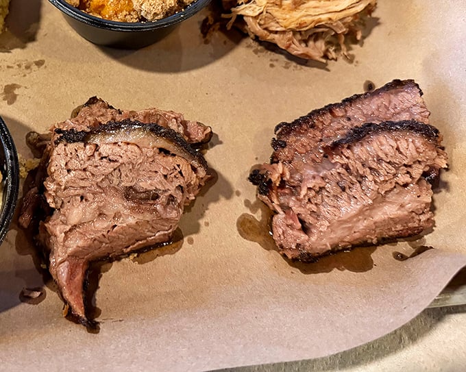 Smoked beef brisket sliced thick with that gorgeous pink smoke ring&mdash;this is what happens when patience and fire become best friends.