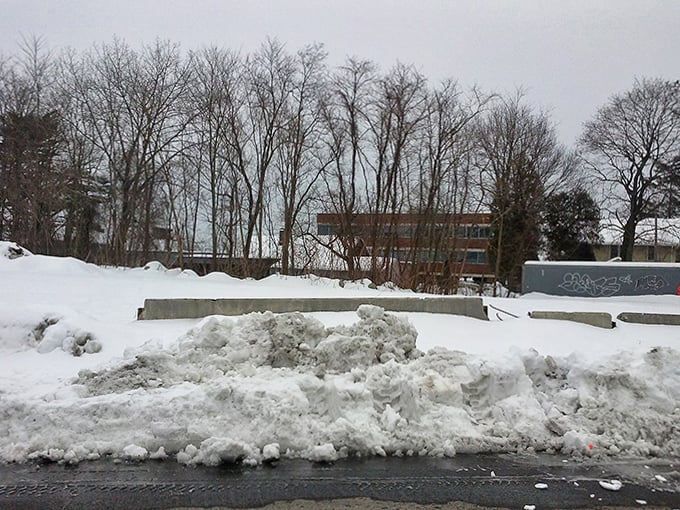 Winter blankets Milford in pristine white. Even the traffic slows down to appreciate the seasonal transformation.