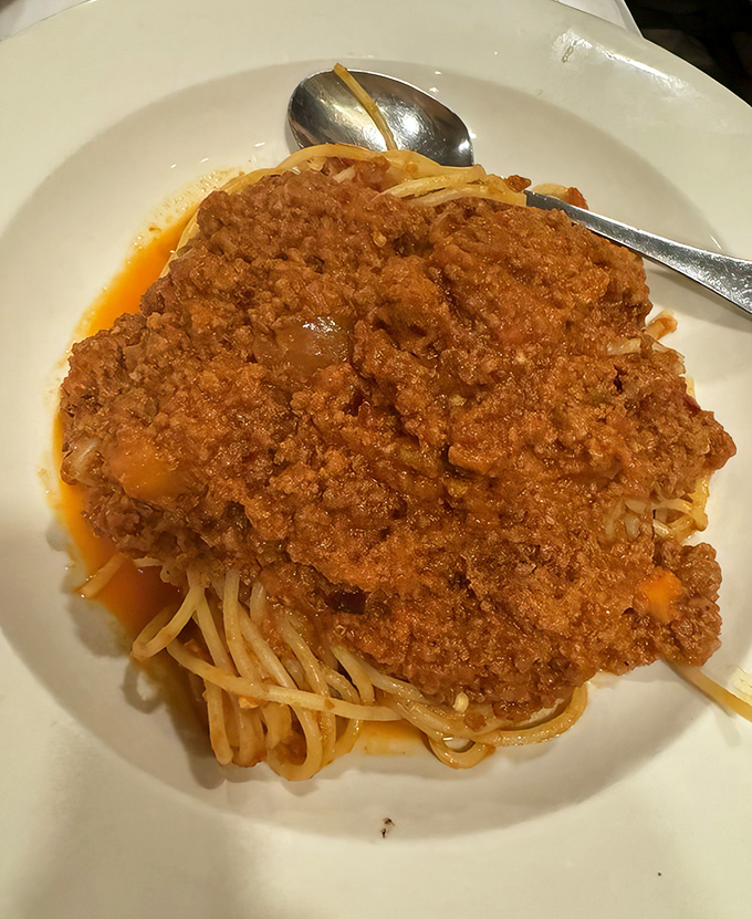 Spaghetti Bolognese that would make an Italian grandmother weep with joy. The sauce-to-pasta ratio is mathematical perfection in edible form.