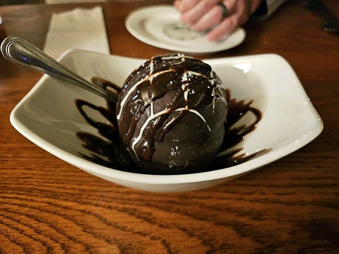 The Spumoni Bomb arrives like a chocolate meteor that crashed into your table from some delicious alternate universe.