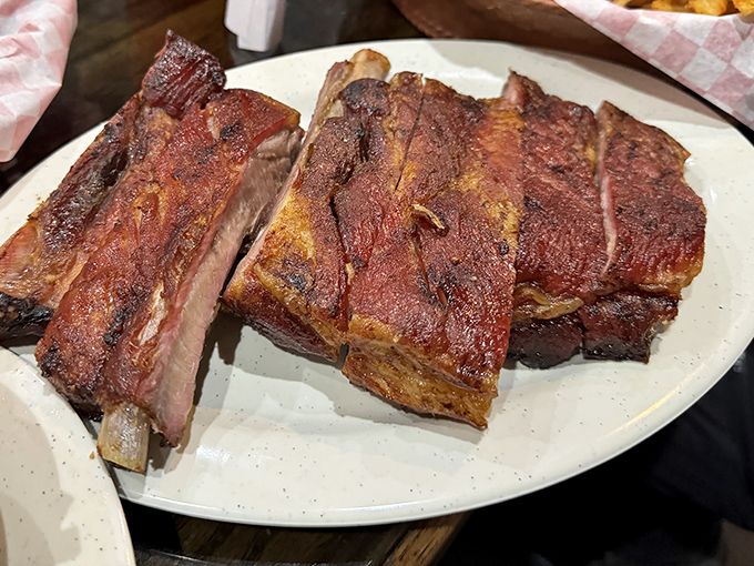 These St. Louis ribs have the kind of smoke ring that makes barbecue enthusiasts weak in the knees. Carnivore poetry on a simple white plate.