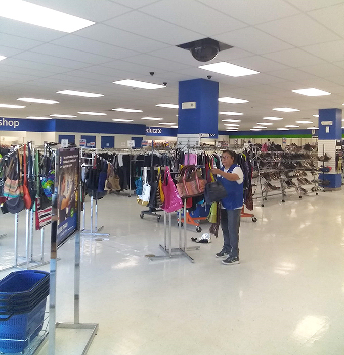 The "educate" sign reminds us that Goodwill's mission extends beyond retail. One person's donation becomes another's opportunity.