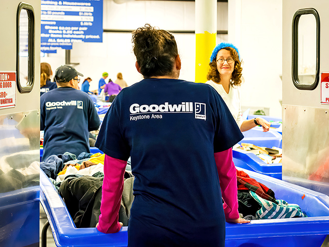 The blue-shirted staff, unsung heroes of the secondhand universe. They're the stage managers of this daily theater of commerce and sustainability.