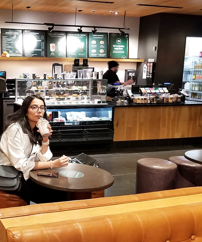 The universal language of caffeine speaks fluently here, where shopping stamina gets its second wind courtesy of Starbucks.