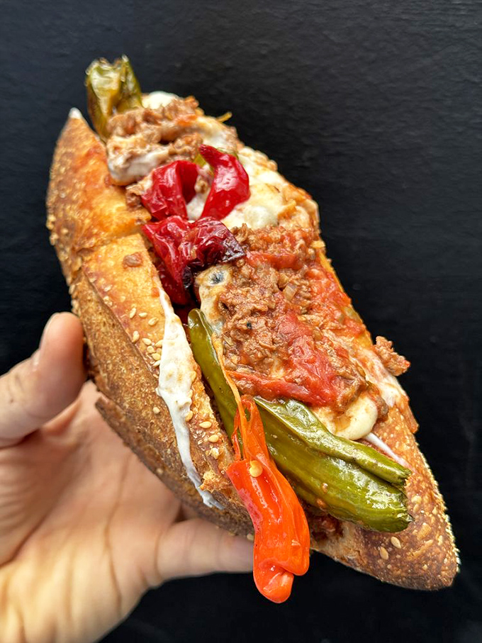 This isn't just a sandwich&mdash;it's a structural marvel. Roasted peppers and melted cheese create the kind of handheld feast that requires both napkins and commitment.