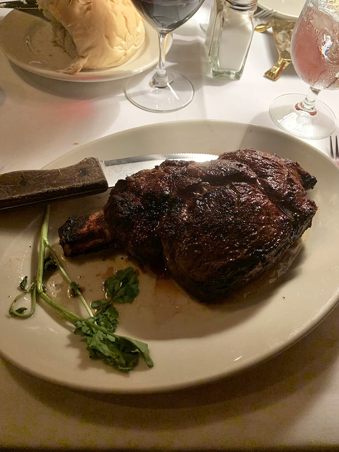 The bone-in ribeye sits majestically on its plate, a carnivore's dream that's been perfected through decades of steakhouse wisdom.