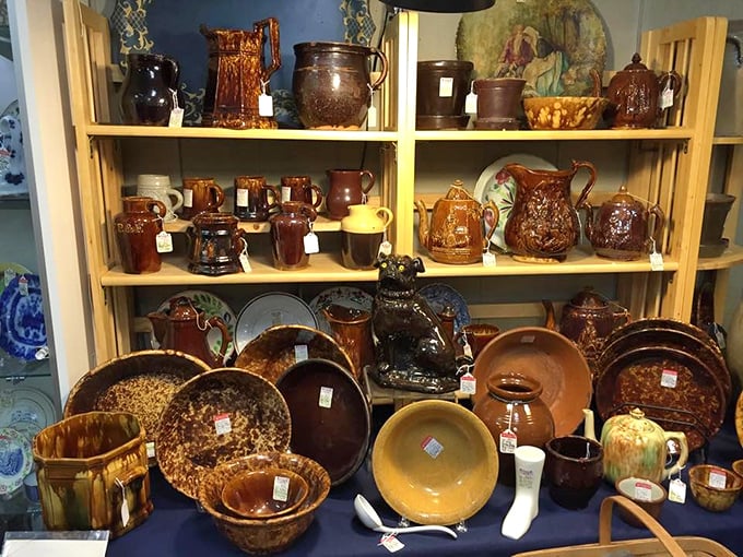 Rockingham pottery and yellowware bowls gather like old friends at a reunion, their glazes mellowed by time and countless Sunday dinners.
