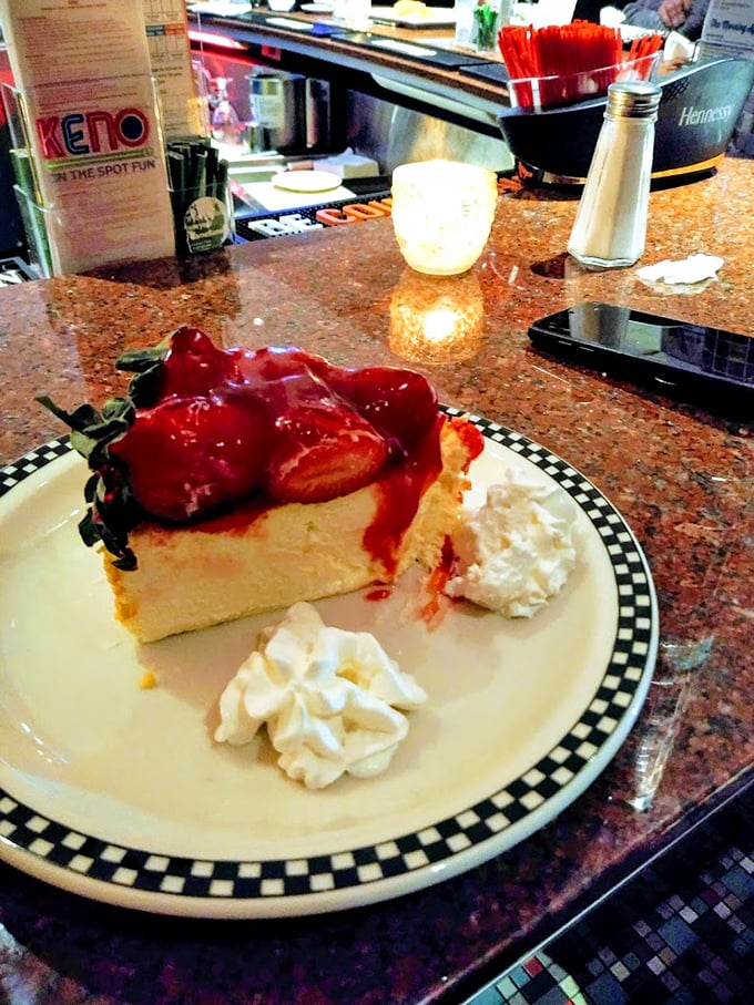 Strawberry cheesecake so creamy and tall, it makes the Leaning Tower of Pisa look structurally sound.