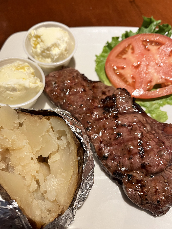 A perfectly seared strip steak with all the fixings. This isn't just food; it's the reason pants with elastic waistbands were invented.