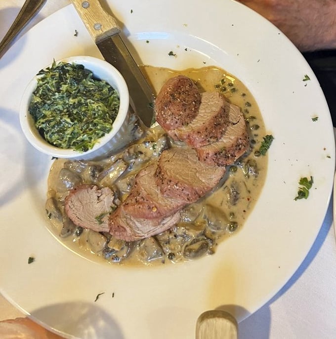 Tender slices of meat bathed in mushroom sauce with a side of creamed spinach&mdash;a plate that whispers "special occasion" even on an ordinary Tuesday.