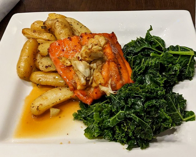 This isn't just dinner&mdash;it's seafood architecture. Fingerling potatoes and vibrant greens provide the foundation for a monument to maritime flavor.