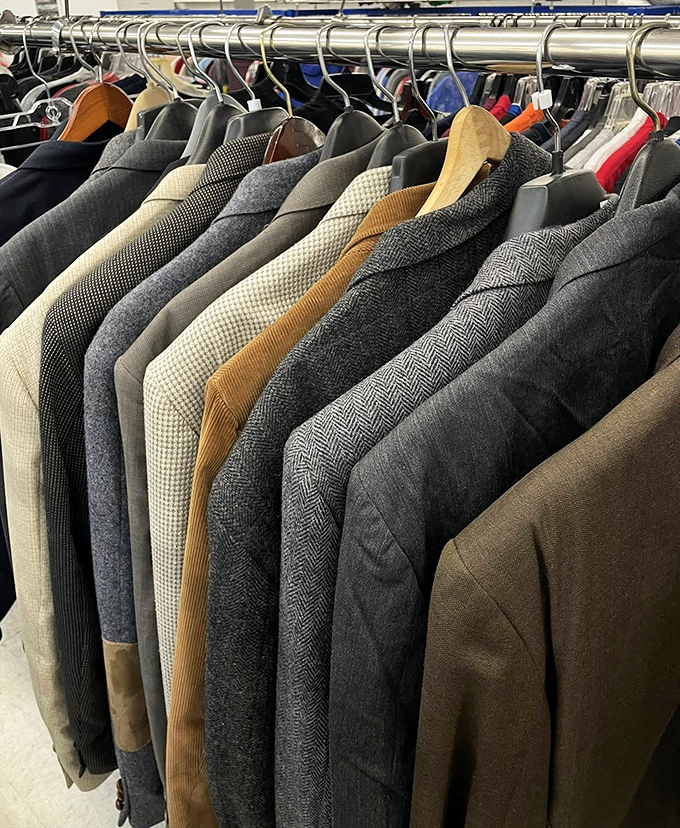 The men's suit section: where business casual meets vintage charm. These tweed and herringbone jackets are waiting for their second act.