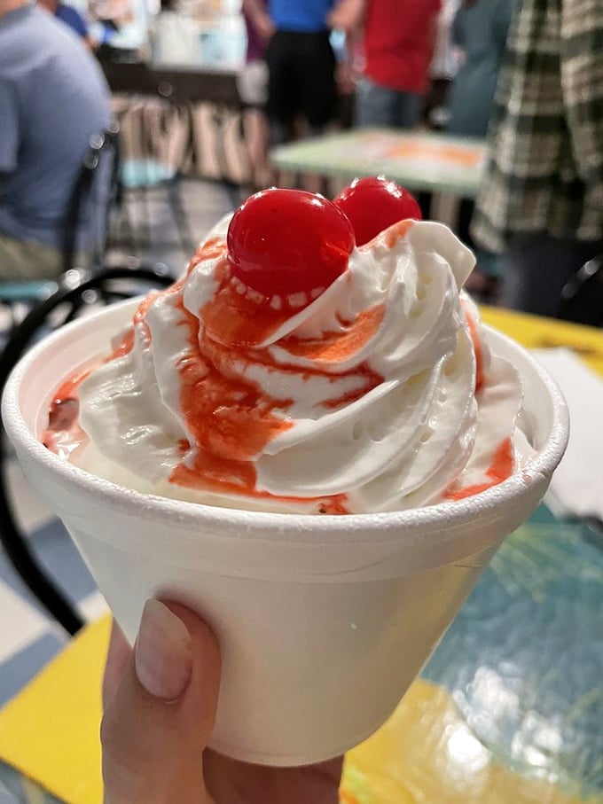 When sundae becomes art&mdash;strawberry swirls and twin cherries creating the dessert equivalent of a beachfront sunset.