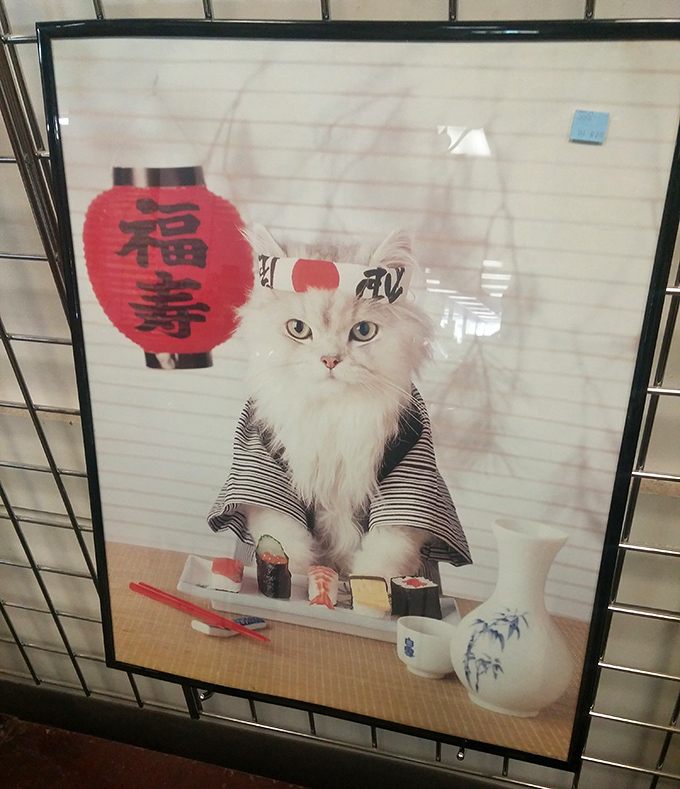 Sushi-making cat art: proof that someone else's "what was I thinking?" purchase can become your home's quirky masterpiece.