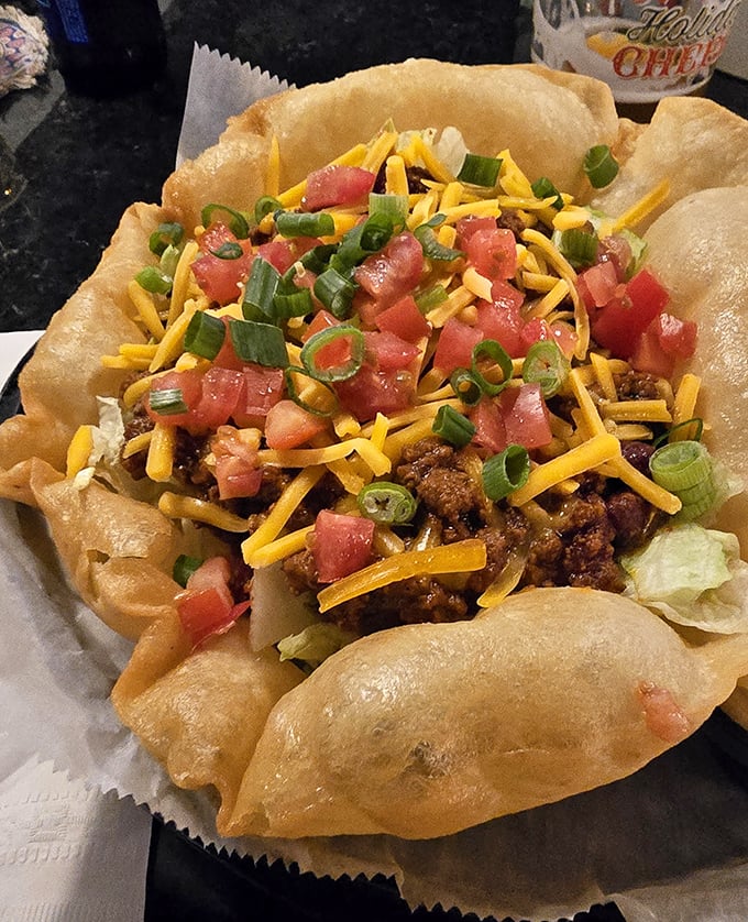This taco salad arrives in an edible bowl because sometimes you need your plate to be part of the meal plan.
