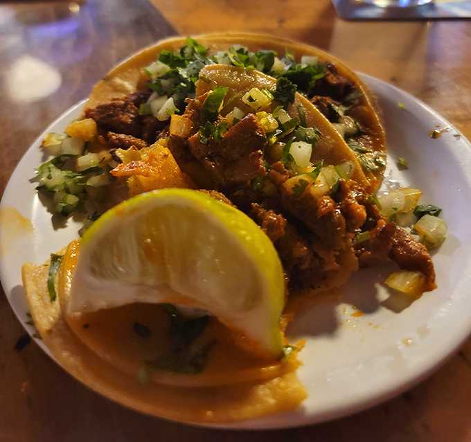 Not your average taco Tuesday fare! These street-style beauties come garnished with fresh cilantro and a lime wedge that's practically begging to be squeezed.