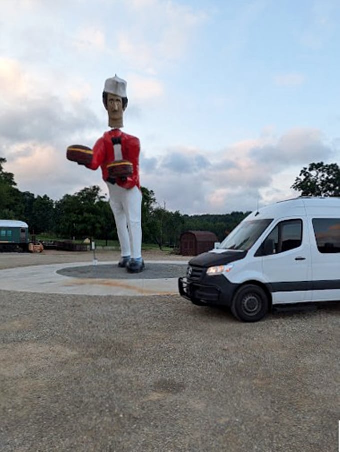 The perfect vantage point reveals just how massive this record-breaking bobblehead truly is. Cars look like toys beside this culinary colossus.