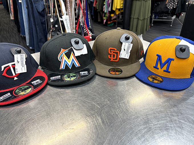 Baseball caps from teams across America, proving that even in Alaska, sports loyalties run deep and secondhand doesn't mean second-rate.
