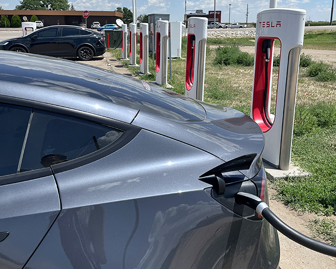 Tesla Superchargers in ranch country symbolize the fascinating collision of old west agriculture meeting new west technology head-on.