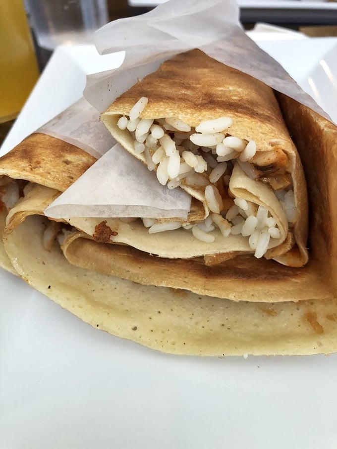Proof that good things come in thin packages. This crepe filled with what appears to be rice showcases the versatility of these delicate French pancakes.