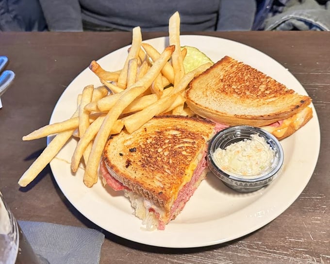 A proper Reuben sandwich that doesn't skimp on the good stuff. Golden-grilled rye bread holding the kind of corned beef that makes vegetarians question their life choices.