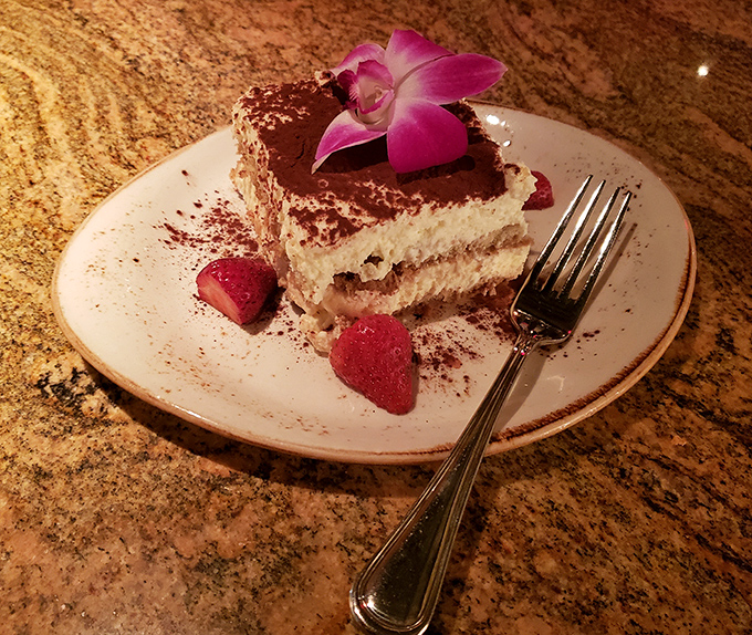 Tiramisu that strikes the perfect balance between coffee, cocoa, and cream. The orchid garnish is just showing off at this point.