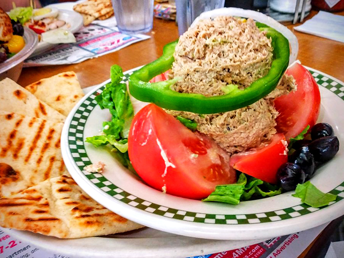 Tuna salad nestled in a green pepper ring with fresh tomato&mdash;proof that diners can do "fancy" without losing their soul. Garden-fresh meets comfort food.