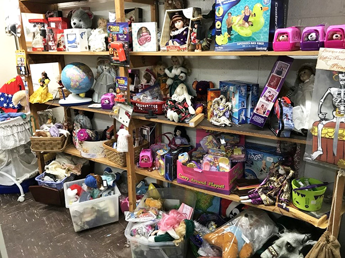 Childhood memories stacked floor to ceiling. That doll might look slightly haunted, but she's just waiting for a new tea party to attend.