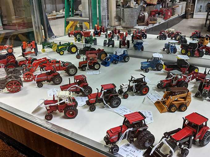 A miniature farm equipment museum where every tractor tells a story. John Deere green has never looked so collectible.